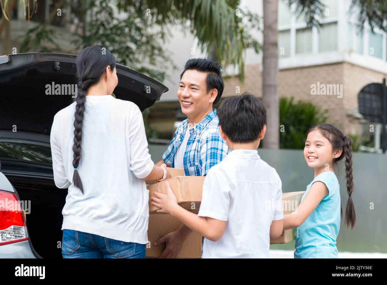 Asian family unpacking cardboard hi-res stock photography and images ...