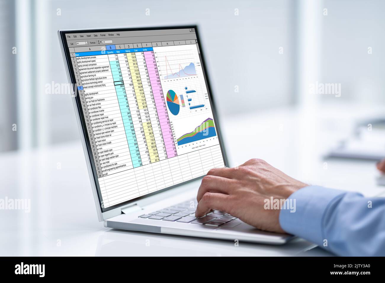 Hand Using Laptop For Spreadsheet Data Work Stock Photo - Alamy