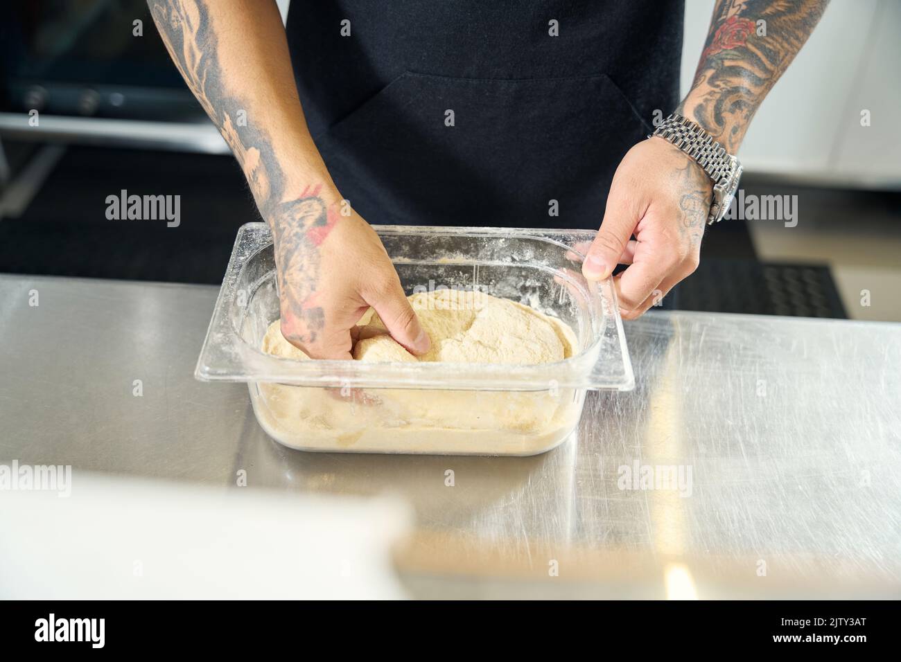Pizza master getting the frozen dough ready for braking Stock Photo - Alamy