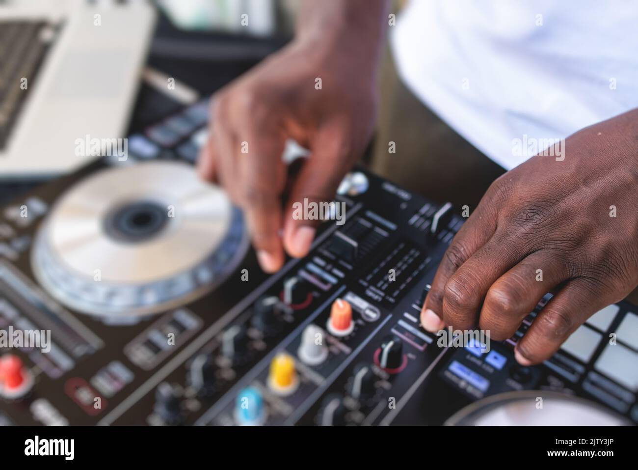 View of Dj mixer and vinyl plate with headphones on a table with ...