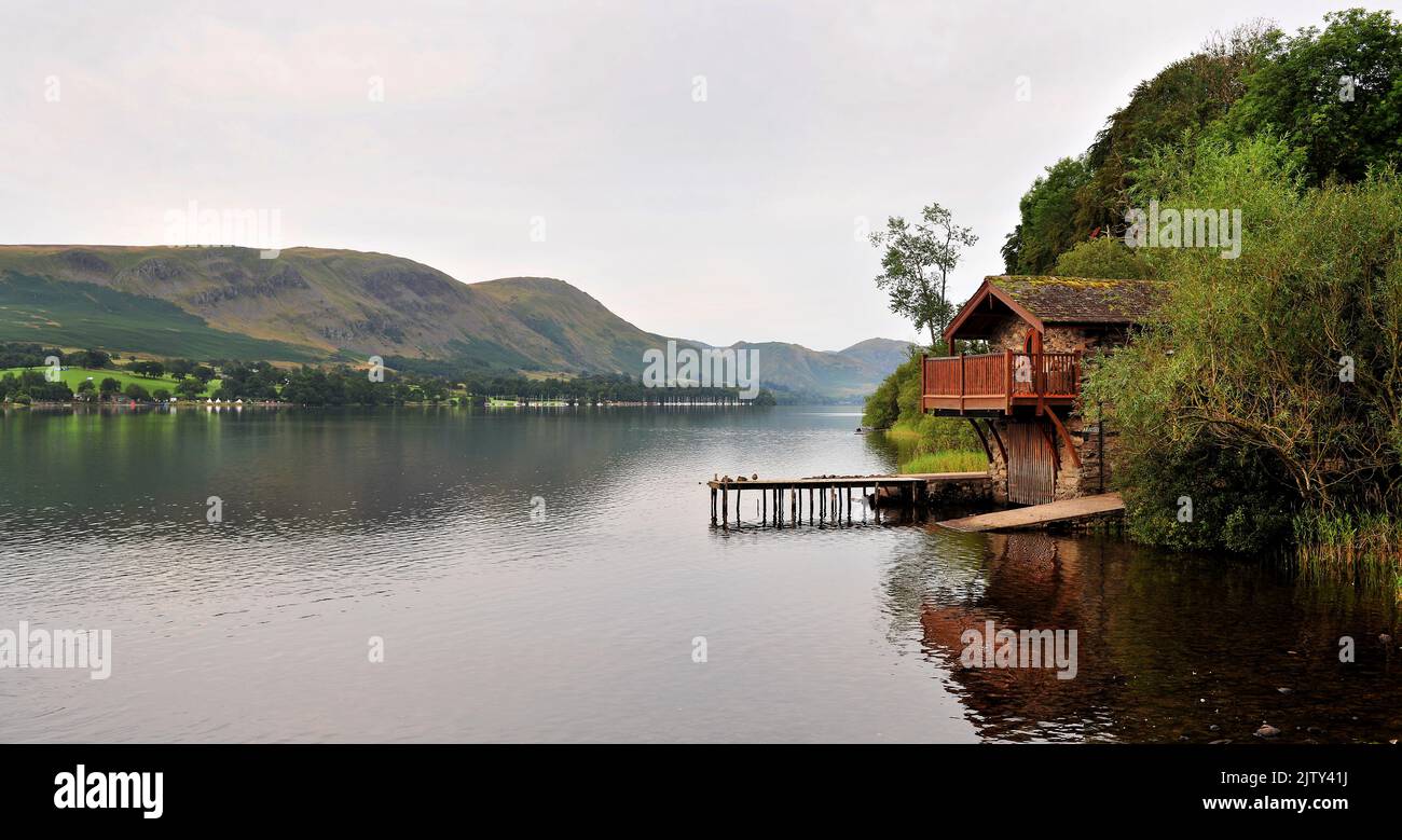 A Lake District boat house on a still grey Ullswater day Stock Photo ...