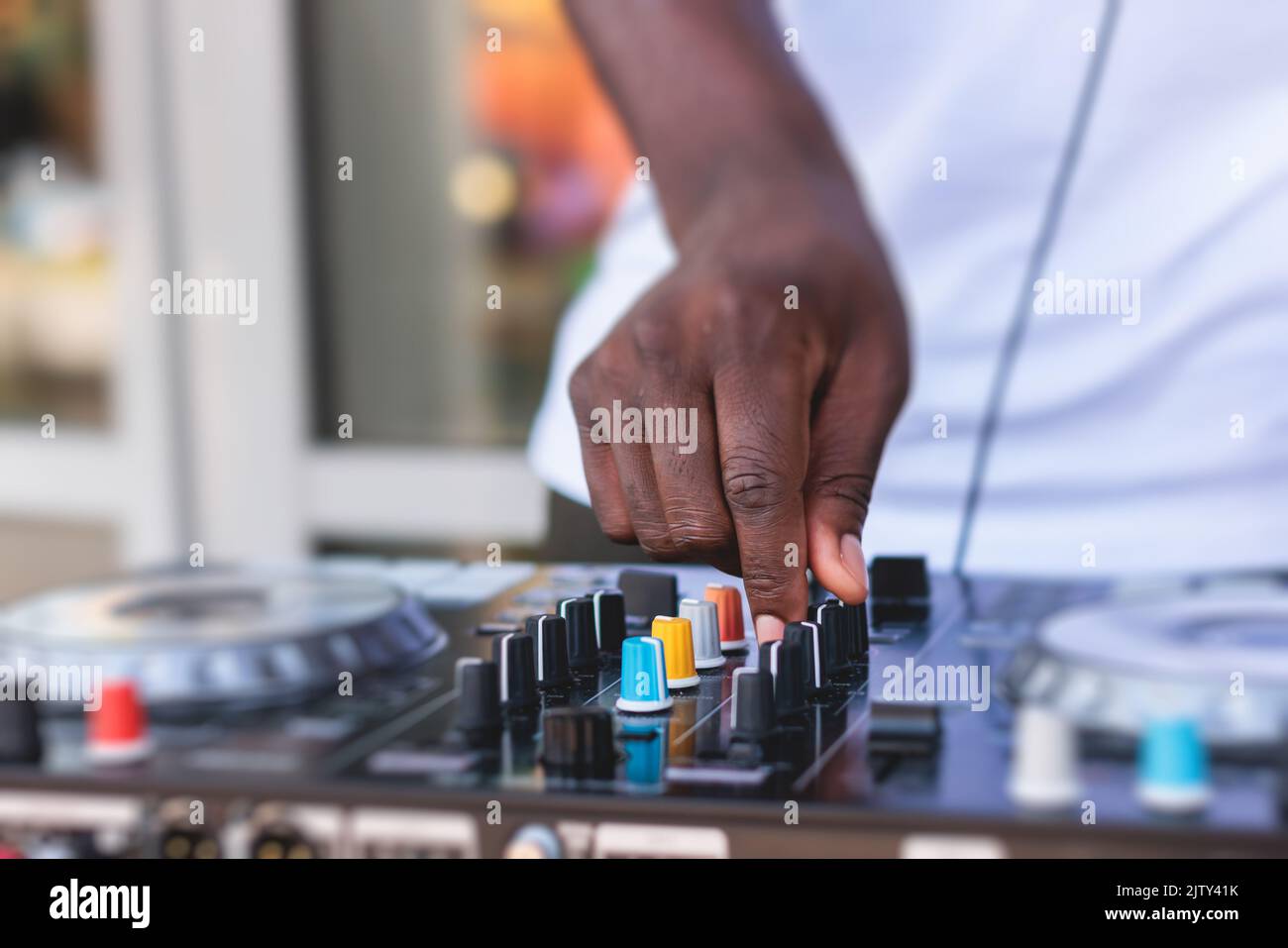 View of Dj mixer and vinyl plate with headphones on a table with ...