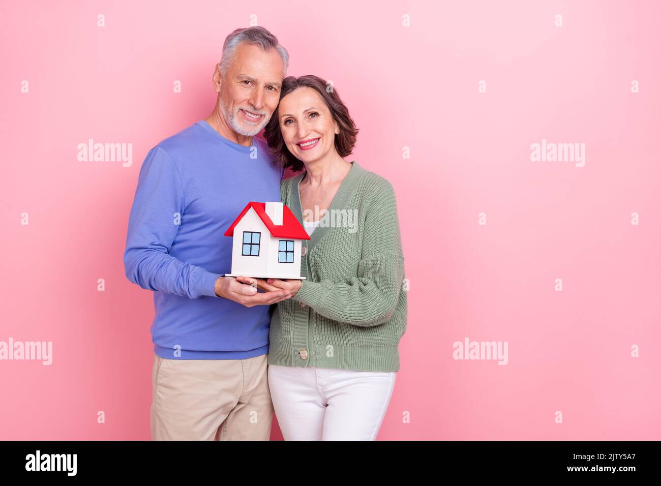 Photo of two peaceful idyllic partners hold small house toothy smile ...