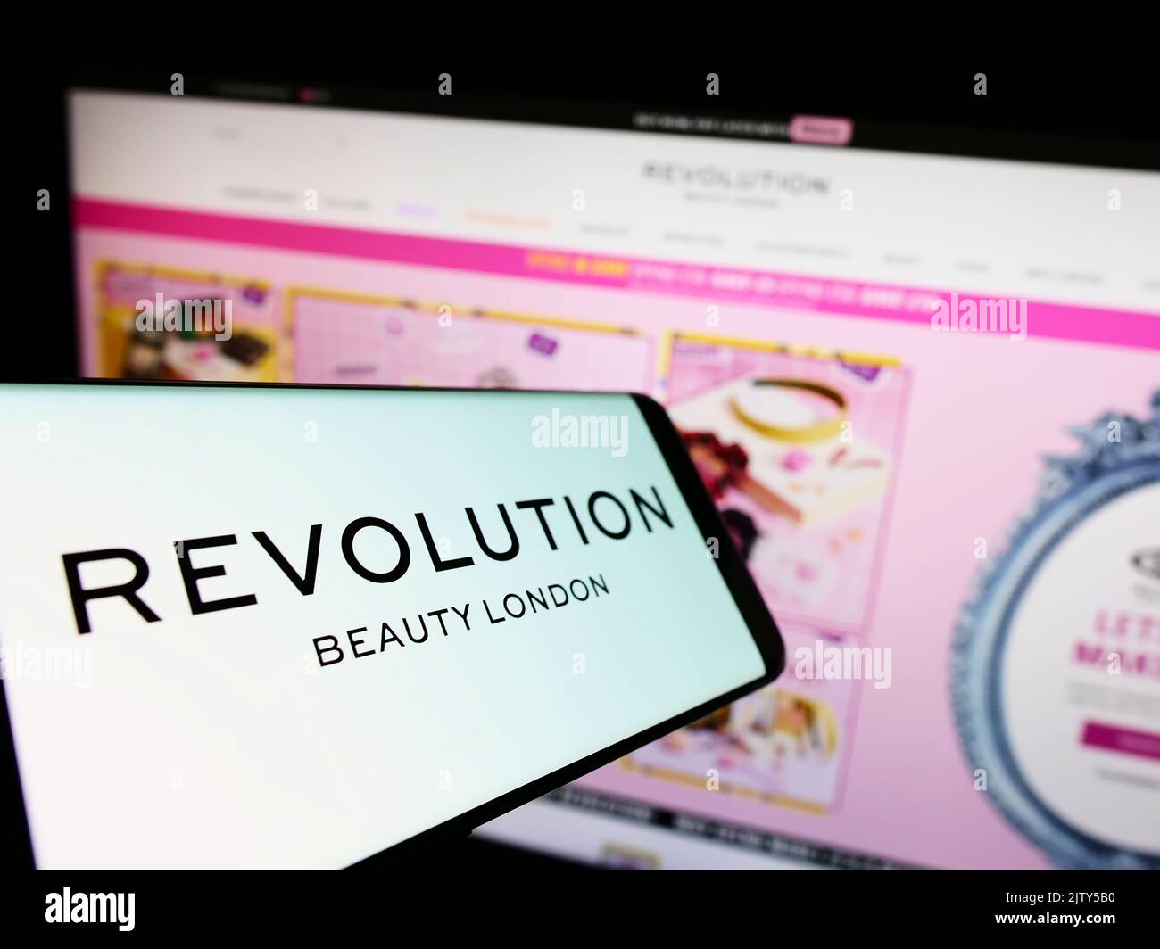 Mobile phone with logo of British e-commerce company Revolution Beauty ...
