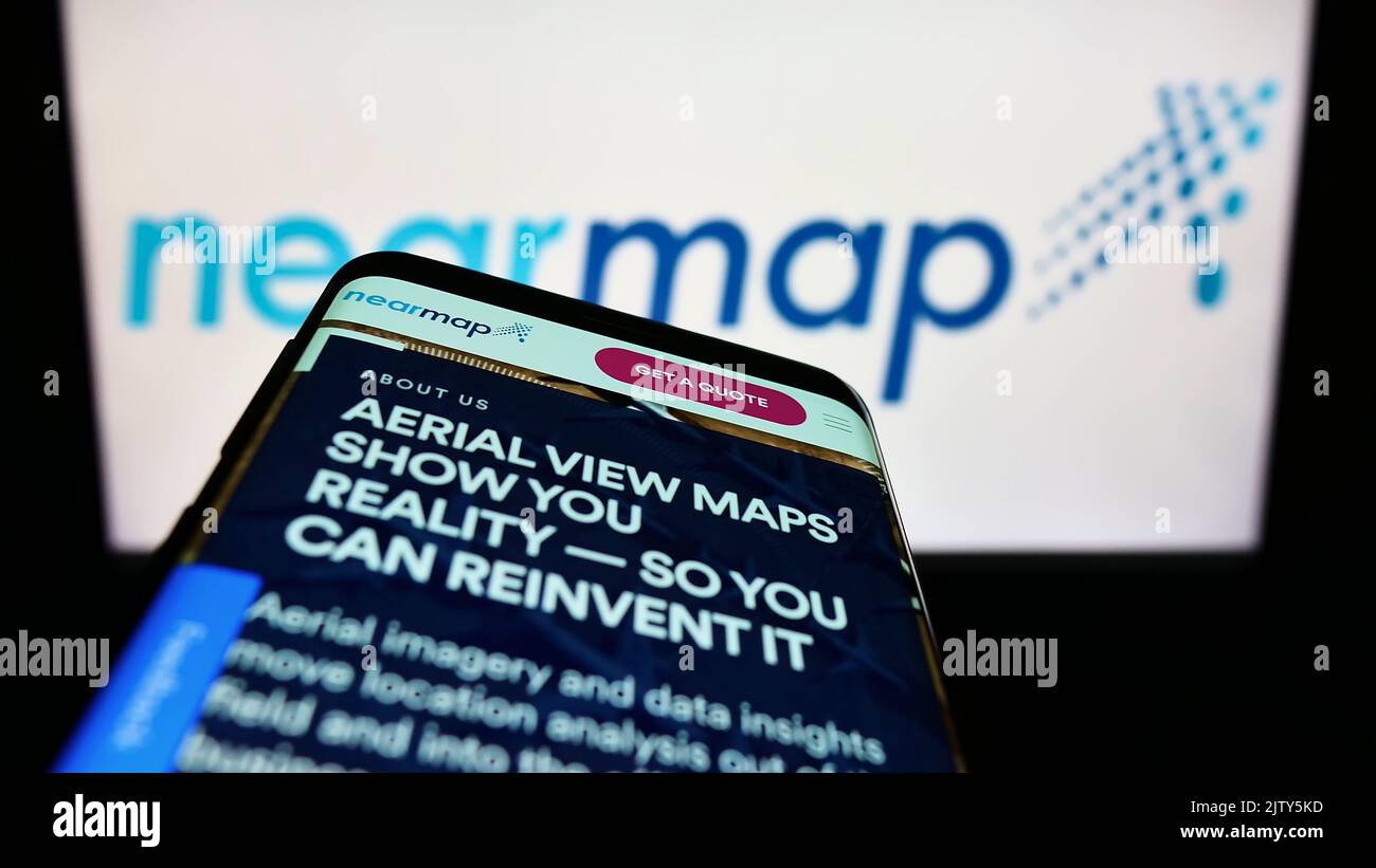 Mobile phone with website of aerial imagery company Nearmap Limited on ...