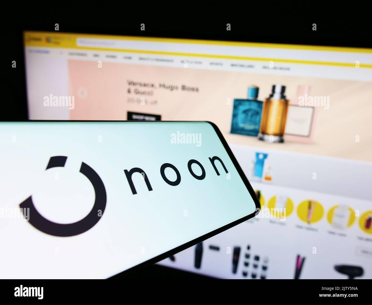 Smartphone with logo of e-commerce company Noon AD Holdings Ltd. on ...