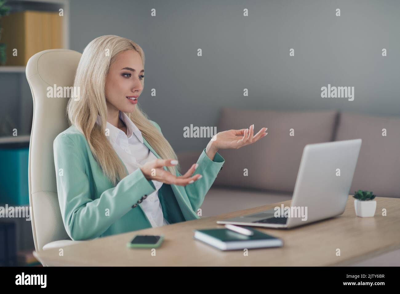 Photo of attractive charming person sitting chair communicate discuss ...