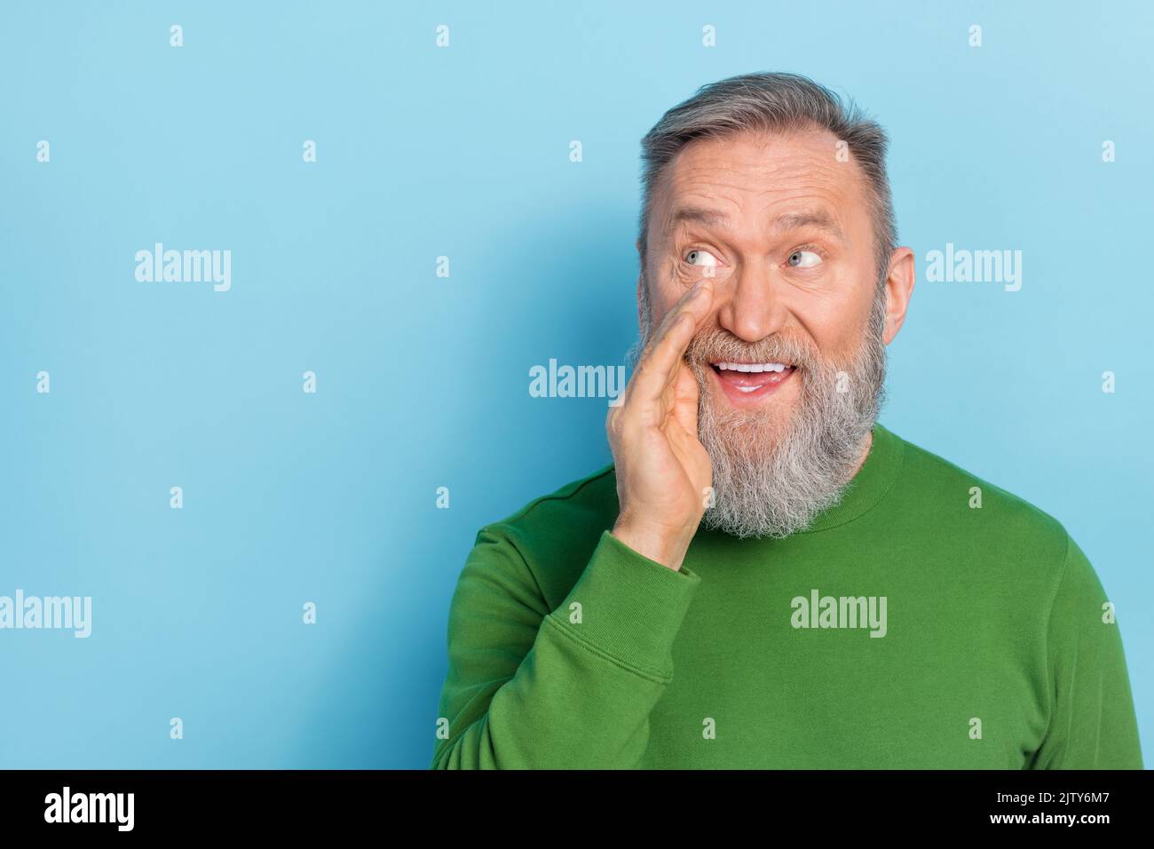 Photo of funky middle aged man look empty space hand lips tell say ...