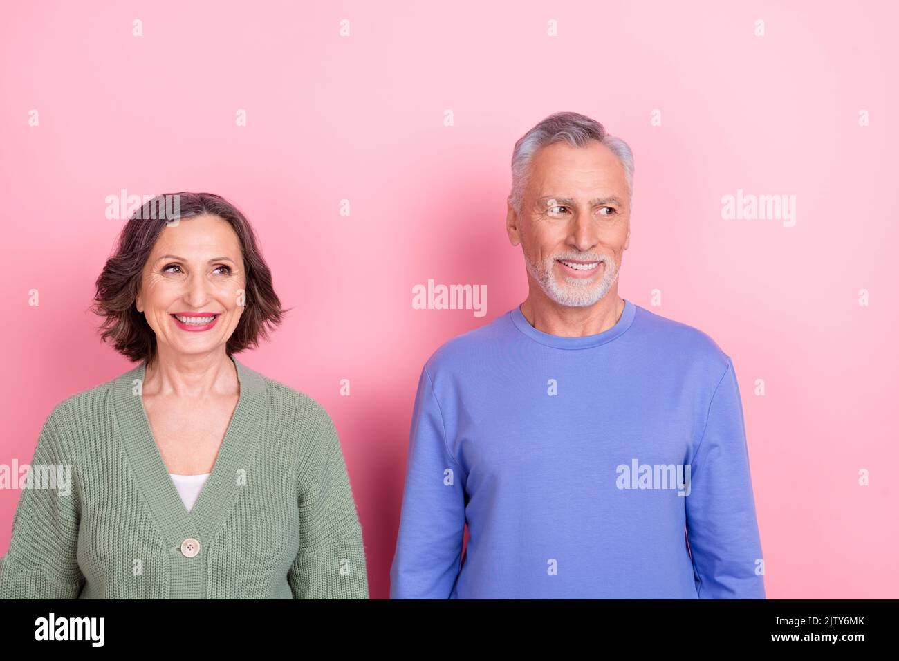Photo of two cheerful partners toothy smile look interested empty space ...
