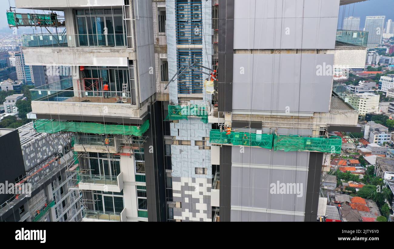 Suspended platform, construction cradle hanging on building ...