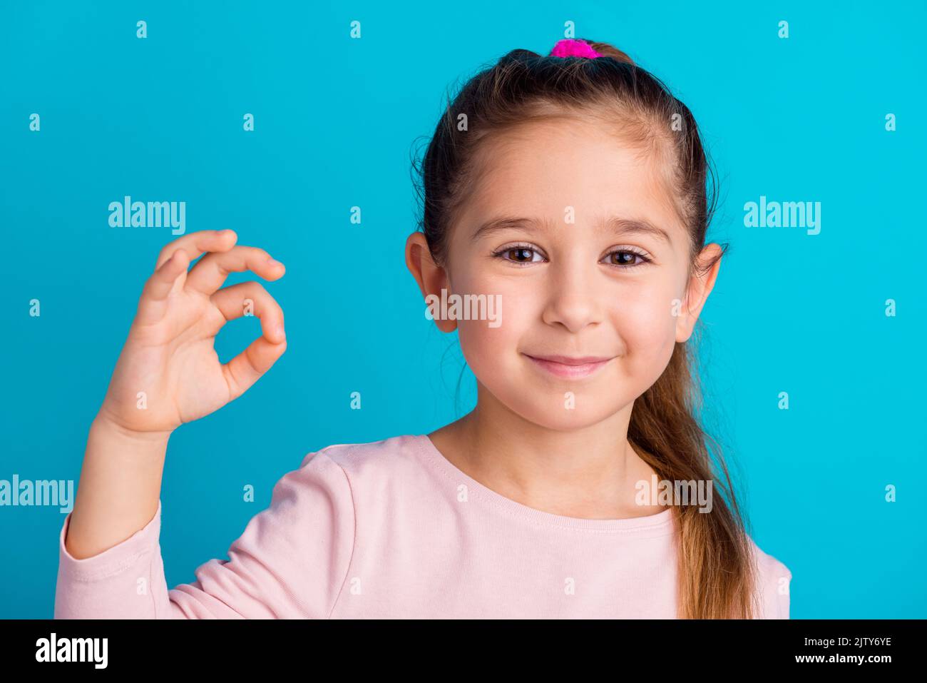 Portrait of positive cute girl hand fingers demonstrate okey symbol ...