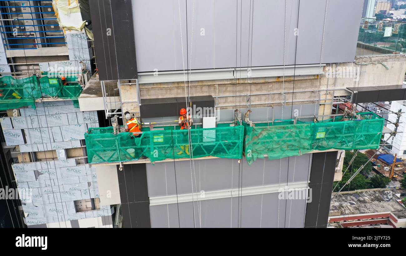 Suspended platform, construction cradle hanging on building ...