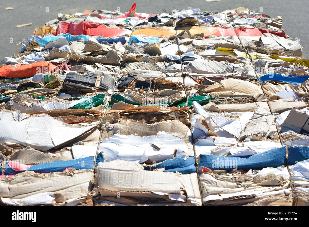 Cardboard pressed into rows for further processing Stock Photo - Alamy
