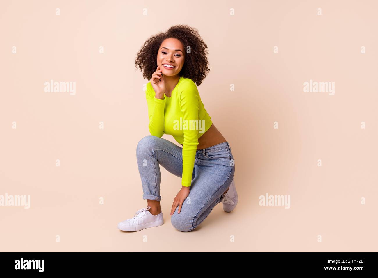 Full size photo of stunning young girl wavy hair touch face posing ...