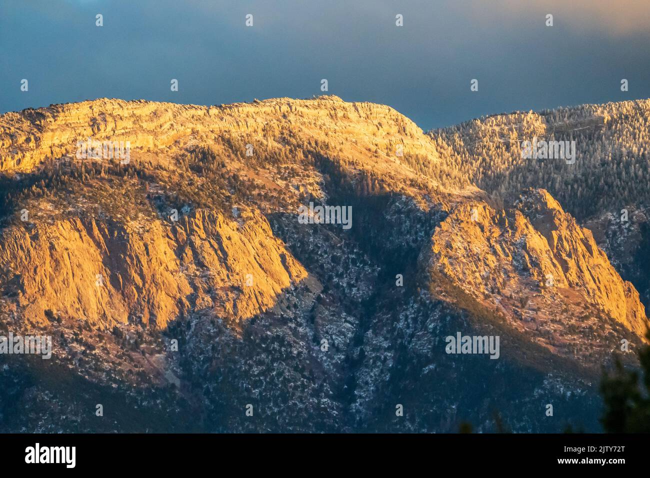 The Sandia Mountain Range in Albuquerque, New Mexico is bathed in late ...