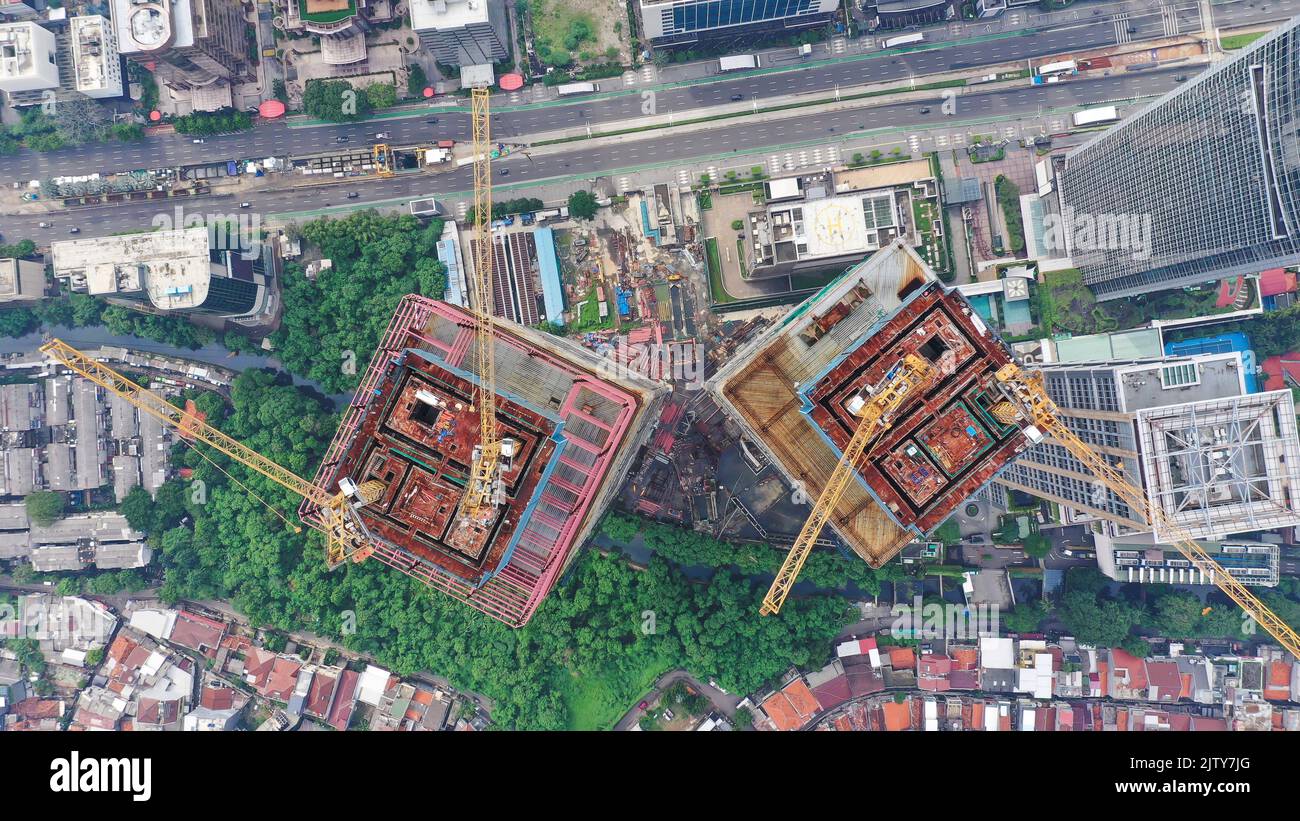 Hi-rise skeleton construction site with the yellow crane Stock Photo ...
