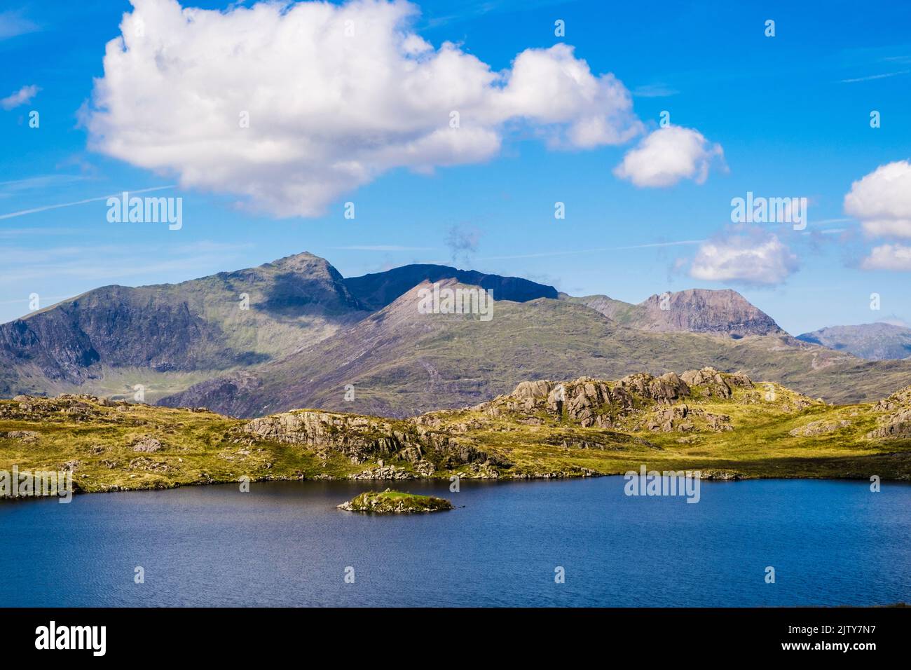 The mount Snowdon horseshoe viewed from across Llyn yr Adar lake on ...