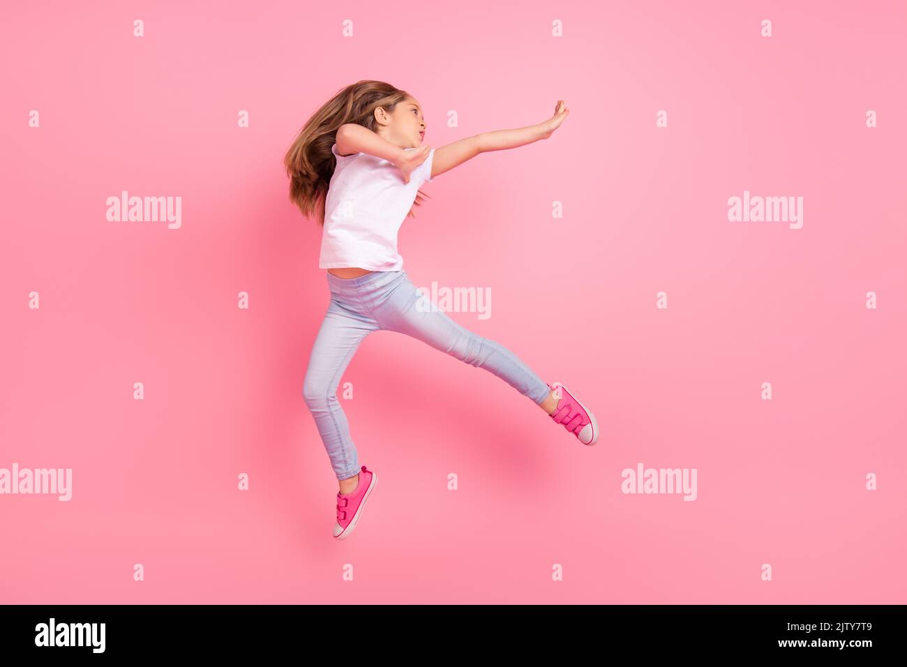 Full body portrait of energetic sportive person jump fight empty space ...