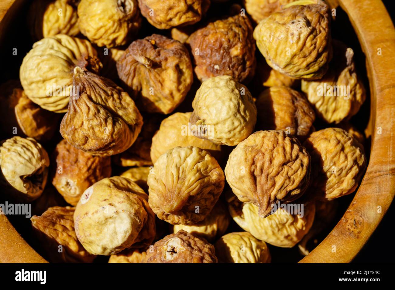 sweet dried figs in an olive wood bowl Stock Photo - Alamy