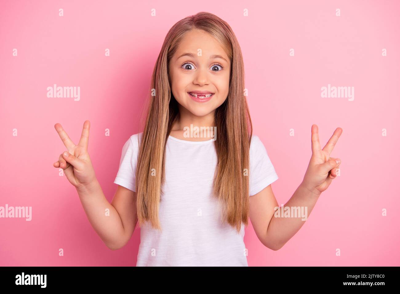 Photo of lovely cheerful kid toothy smile hands fingers show v-sign ...