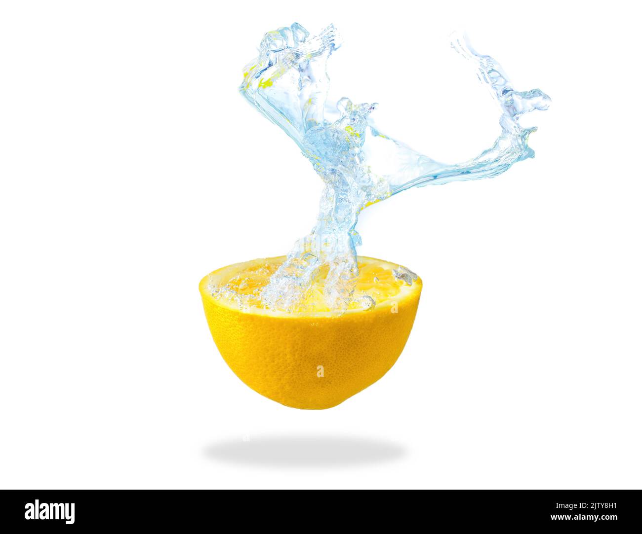 Lemon half dropped in water with splashes Stock Photo - Alamy