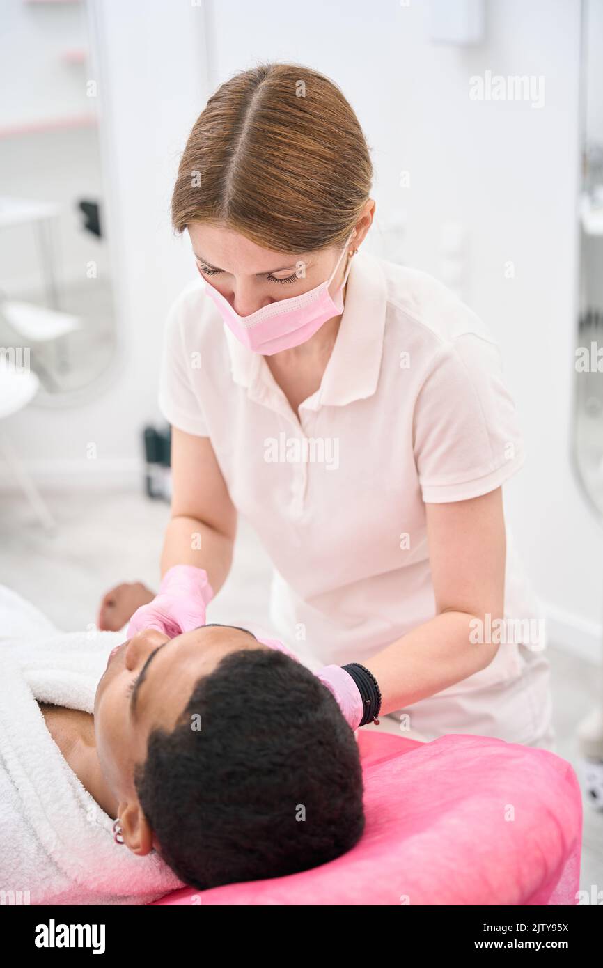 Beauty salon aesthetician performing hi-res stock photography and ...