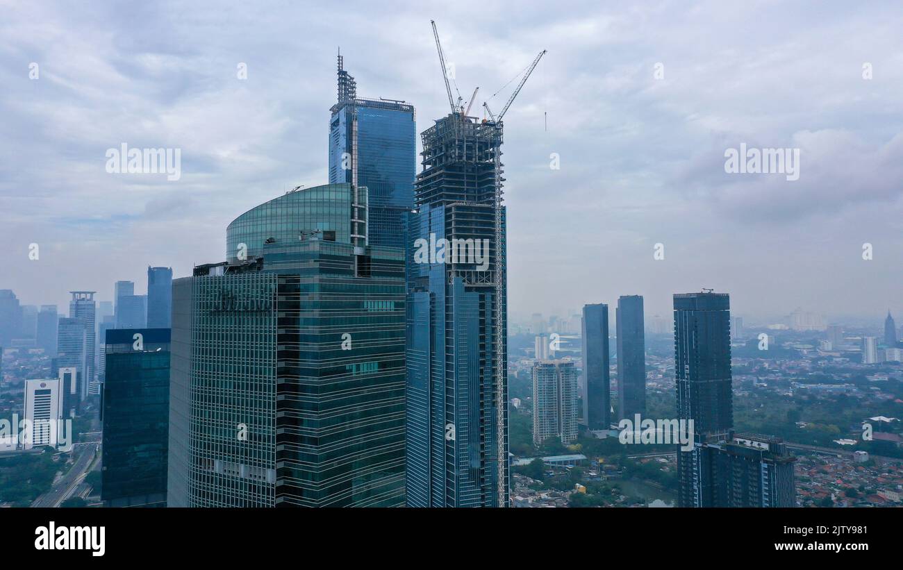Construction of high-rise skyscrapers with many floors using cranes ...