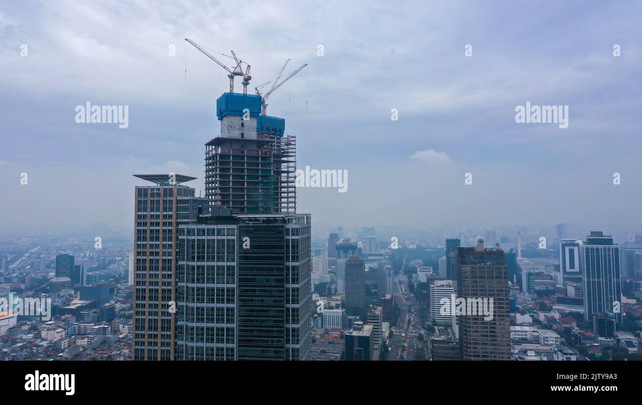 Construction of high-rise skyscrapers with many floors using cranes ...