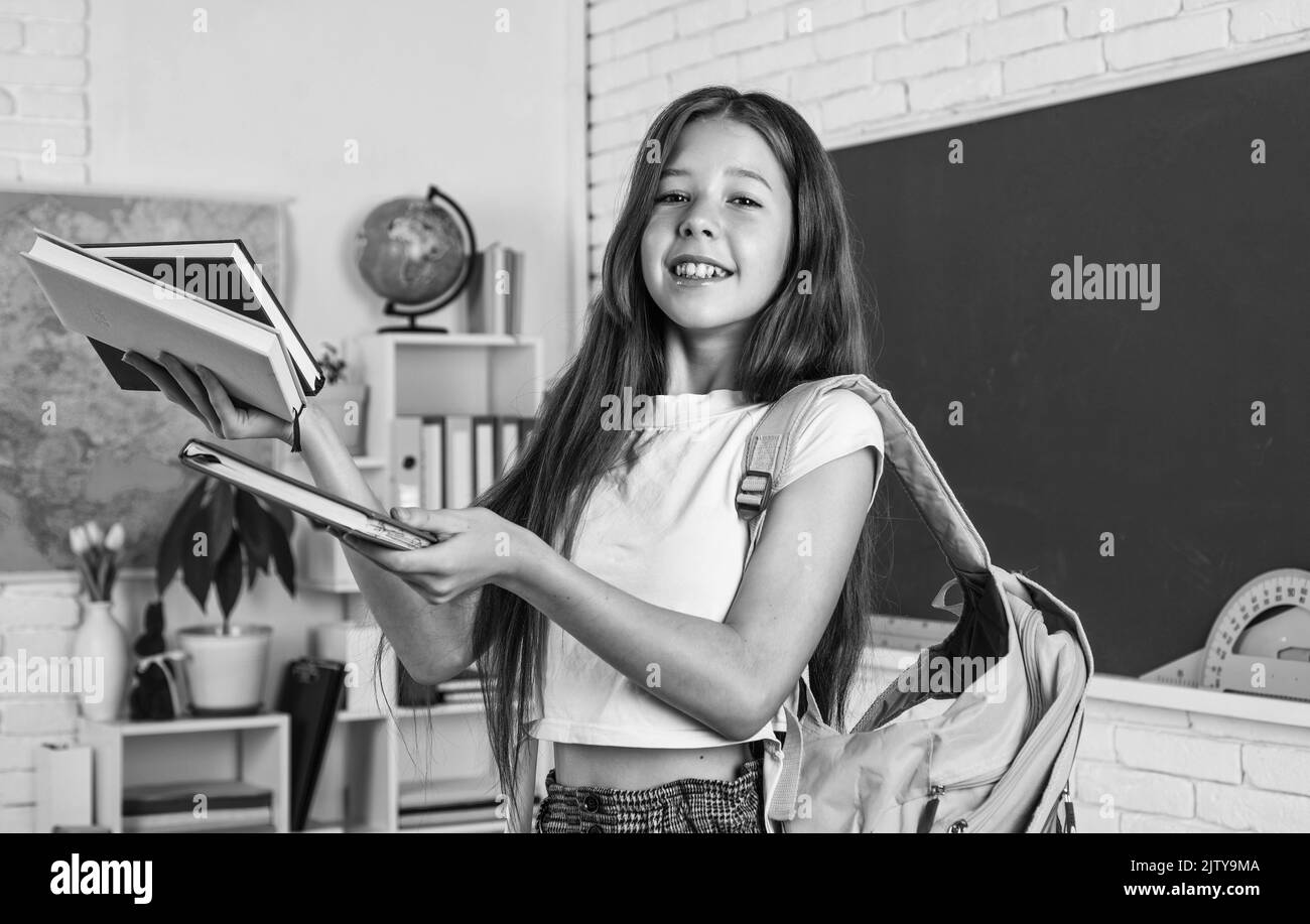 happy child girl carry backpack and books at school, back to school ...