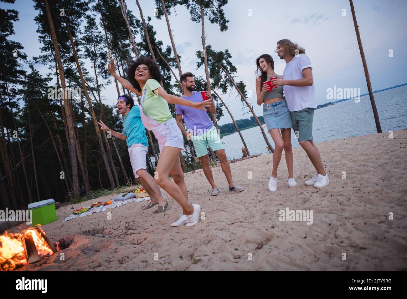 Full size photo of young guys ladies drink beer dance wear casual ...