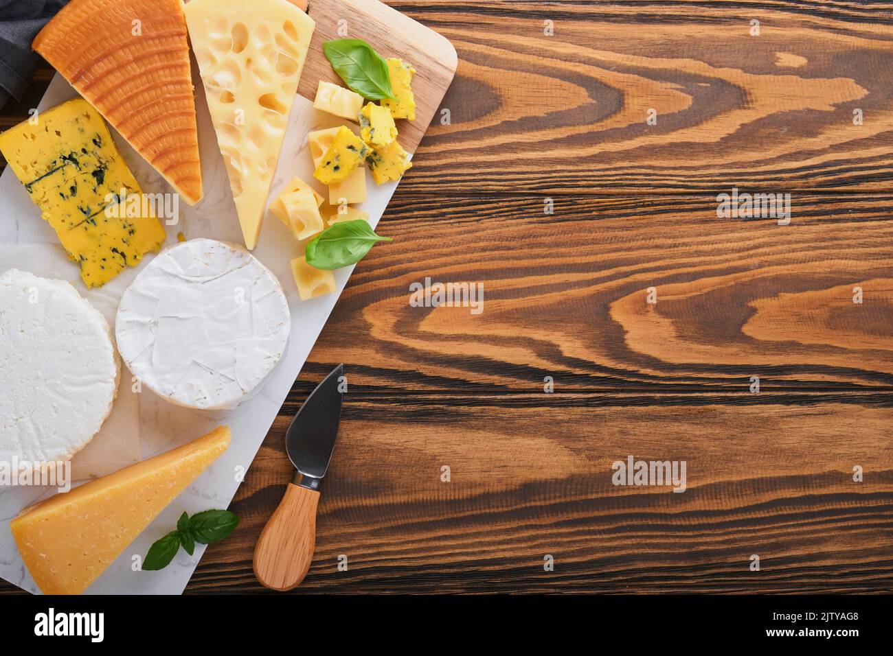 Set or assortment cheeses. Maasdam, smoked cheese, camembert, blue ...