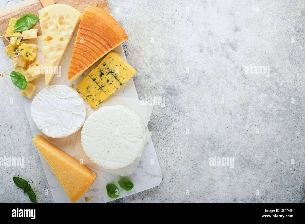 Set or assortment cheeses. Maasdam, smoked cheese, camembert, blue ...