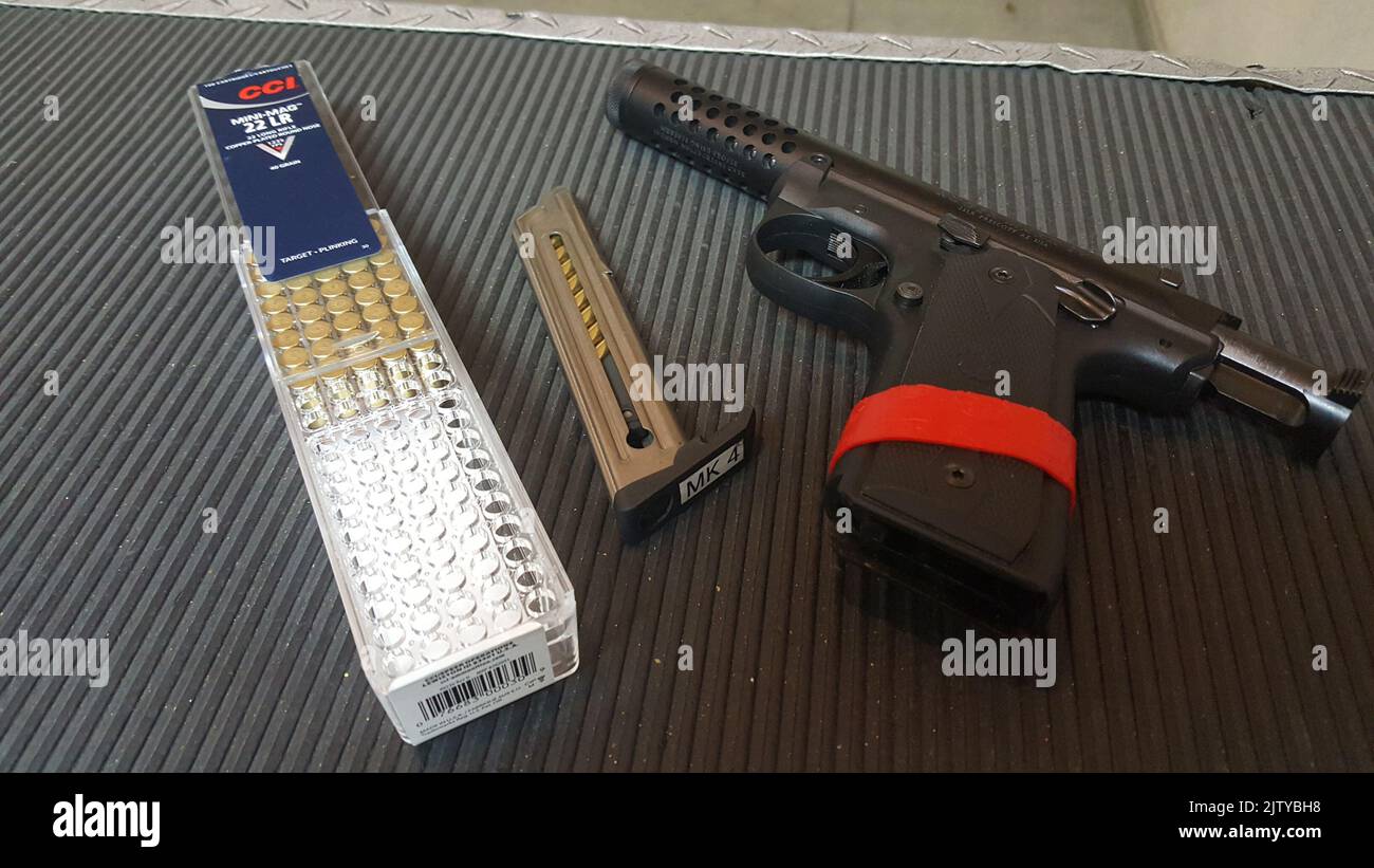 Ruger Mk 1V handgun with .22 calibre ammunition on a gun range in ...