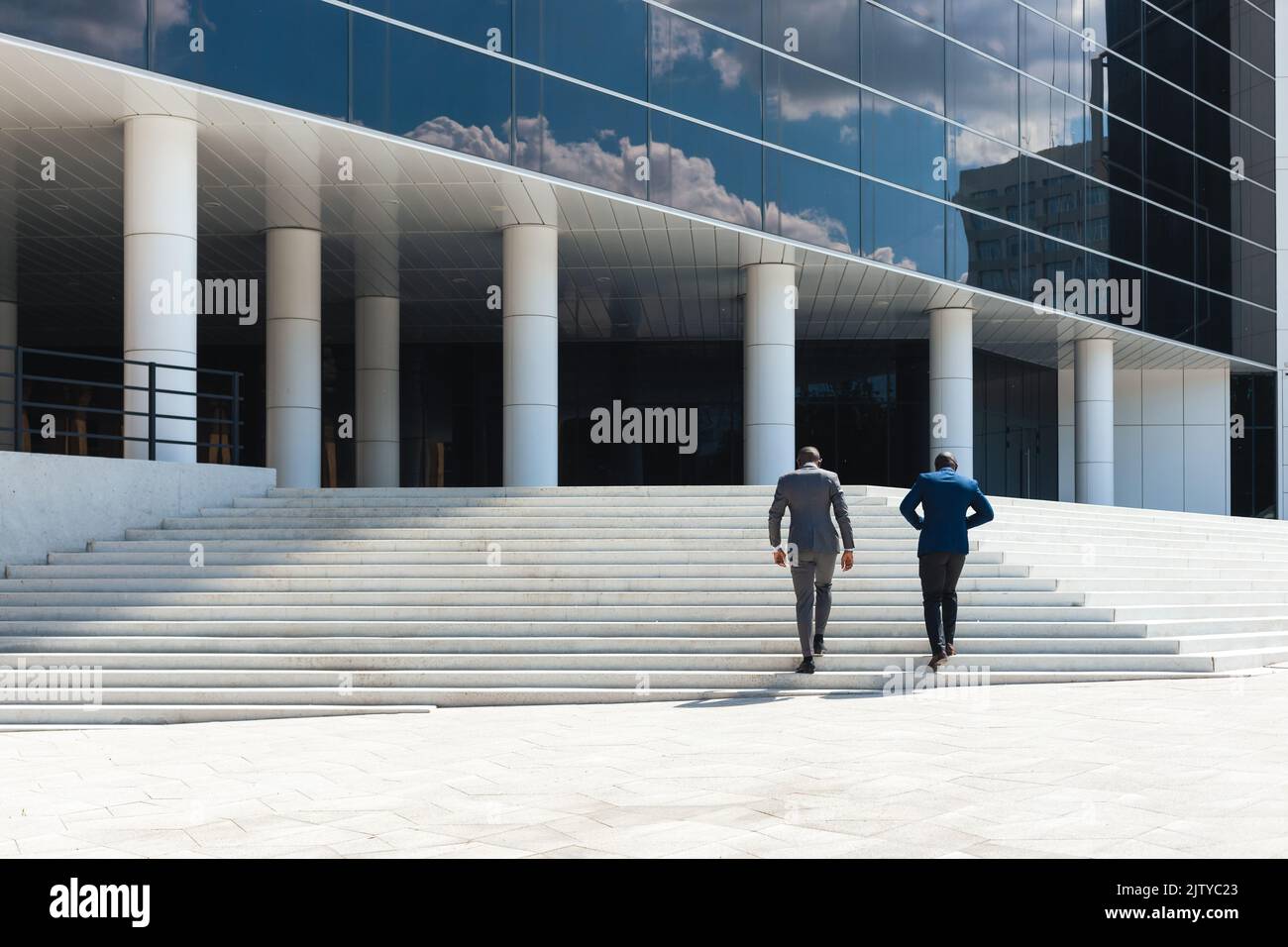 Business people climb the stairs of the city stairs. Close-up of the ...