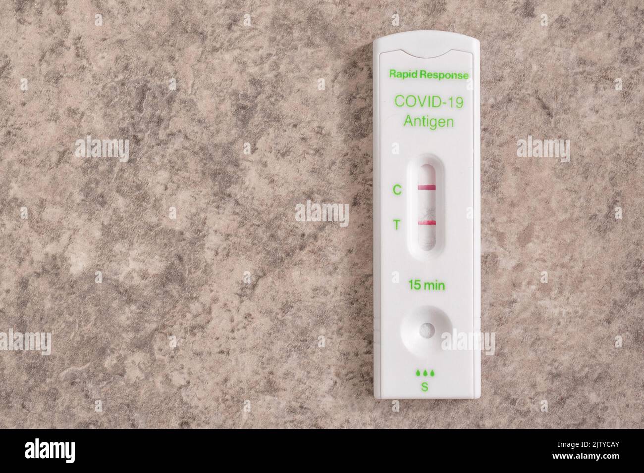 COVID rapid test strip showing positive Stock Photo - Alamy