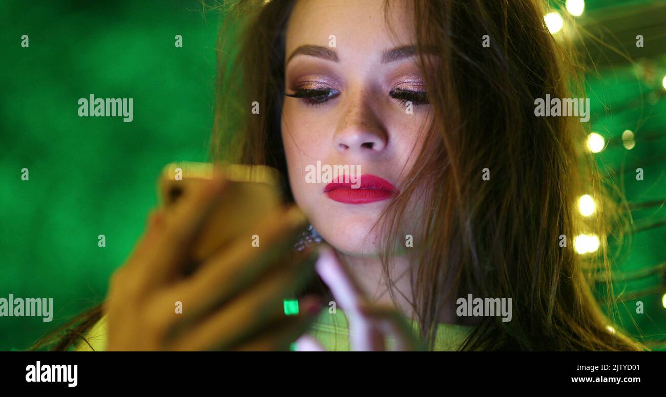 Pretty girl using smartphone at night touching cellphone screen Stock ...