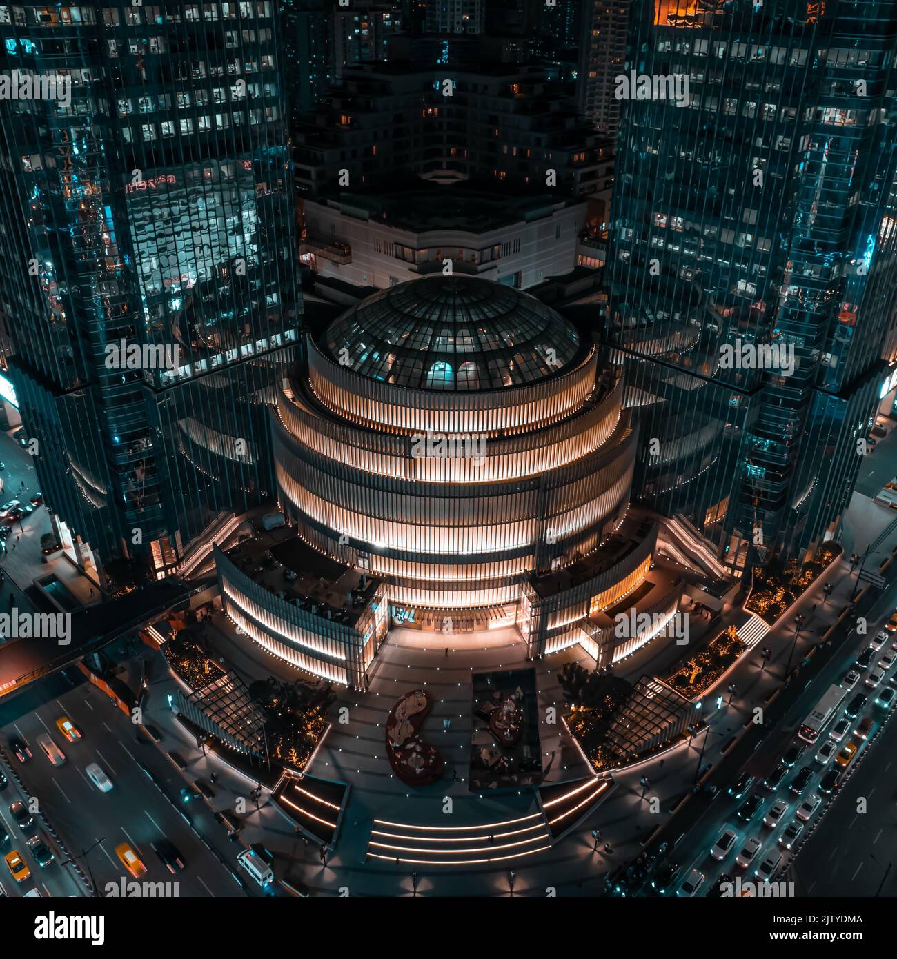 An aerial view of a modern building illuminated at night in Shanghai ...