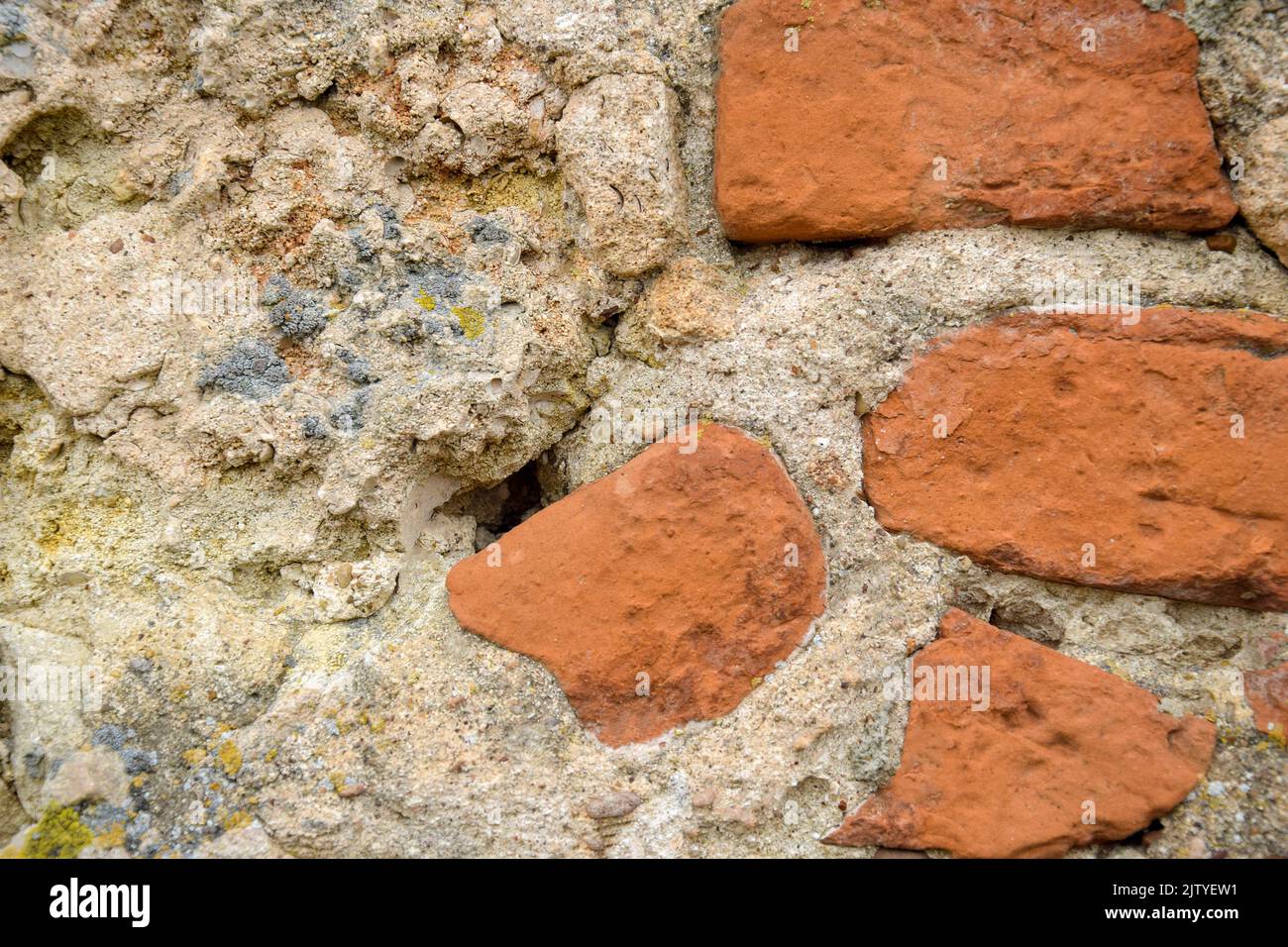 Old Worn Down Brick Wall with Plaster and Moss. Grunge Red Stonewall ...
