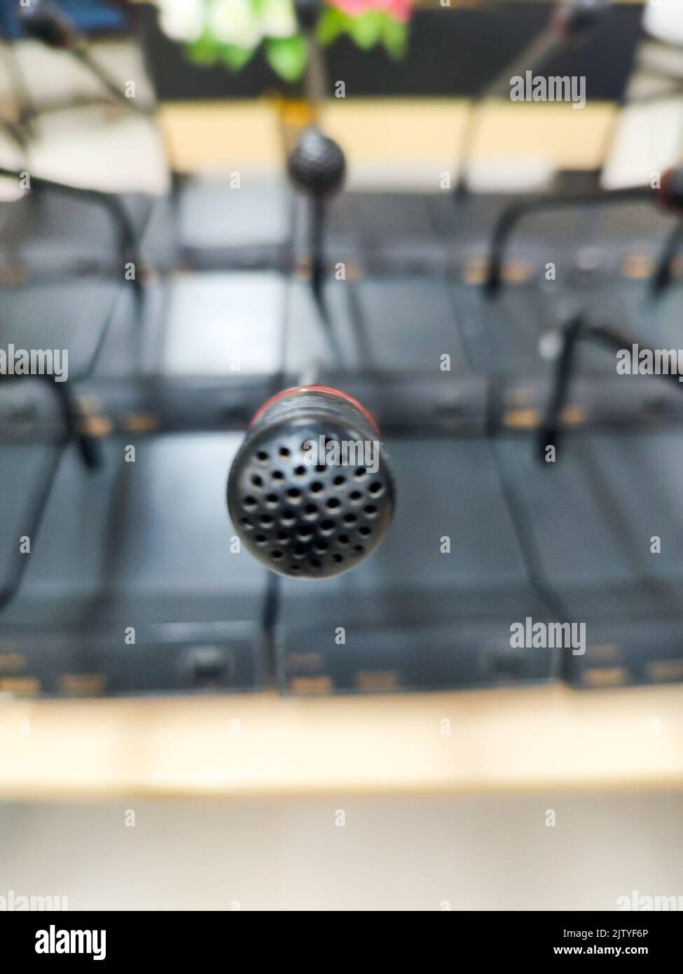 A mic in focus among several. The mics are placed for a information ...