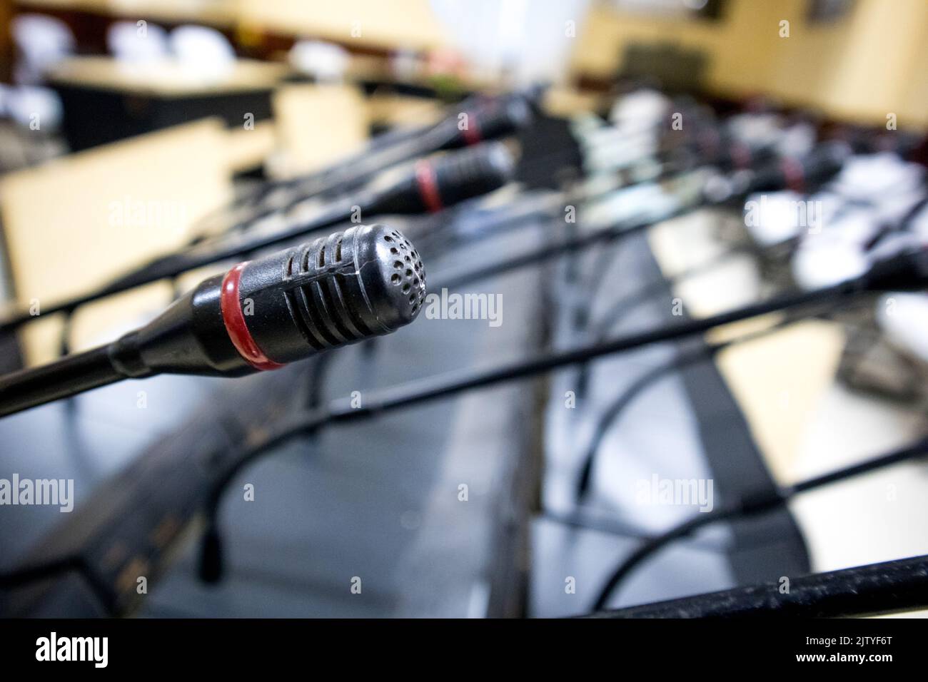 A mic in focus among several. The mics are placed for a information ...