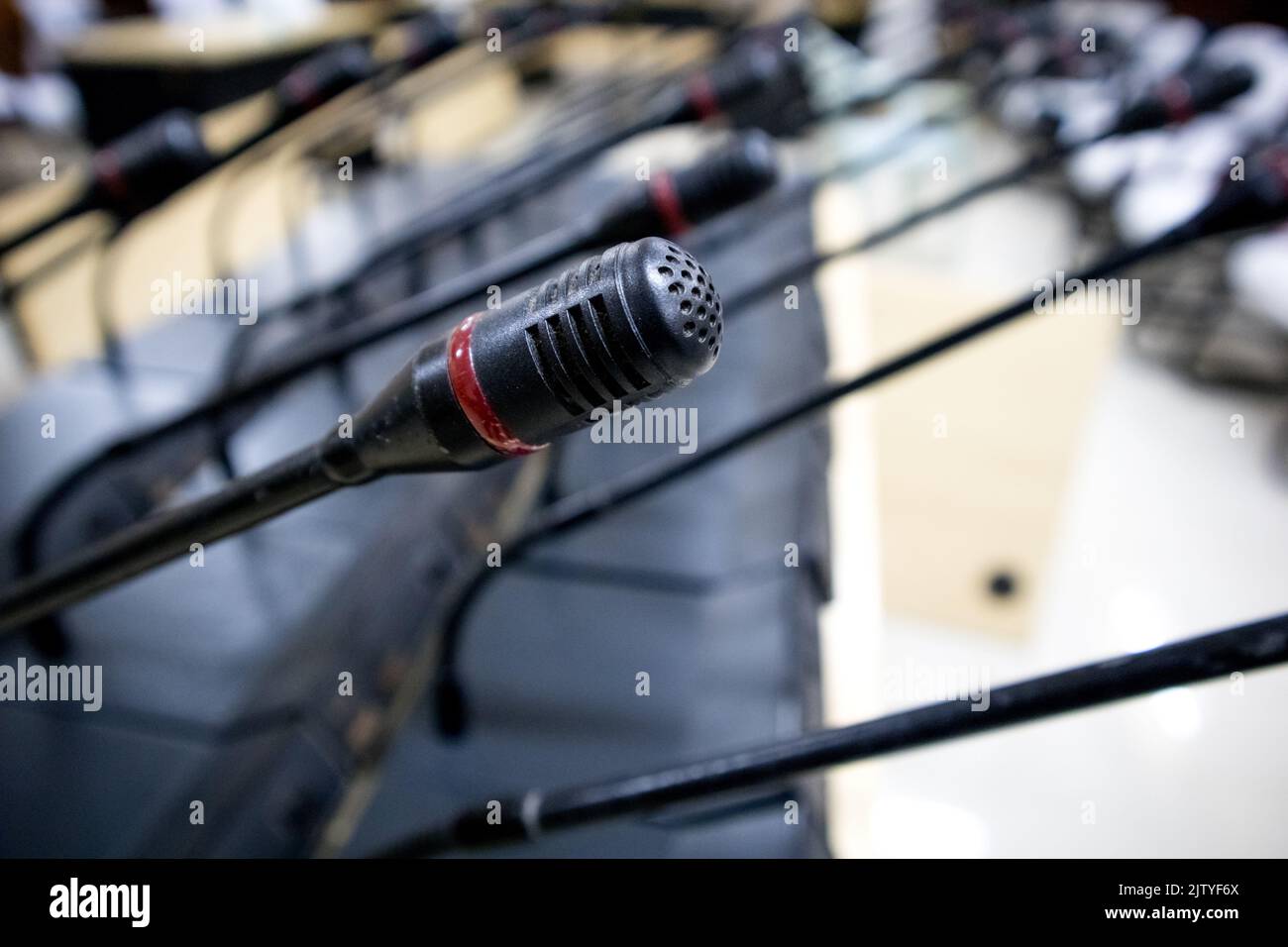 A mic in focus among several. The mics are placed for a information ...
