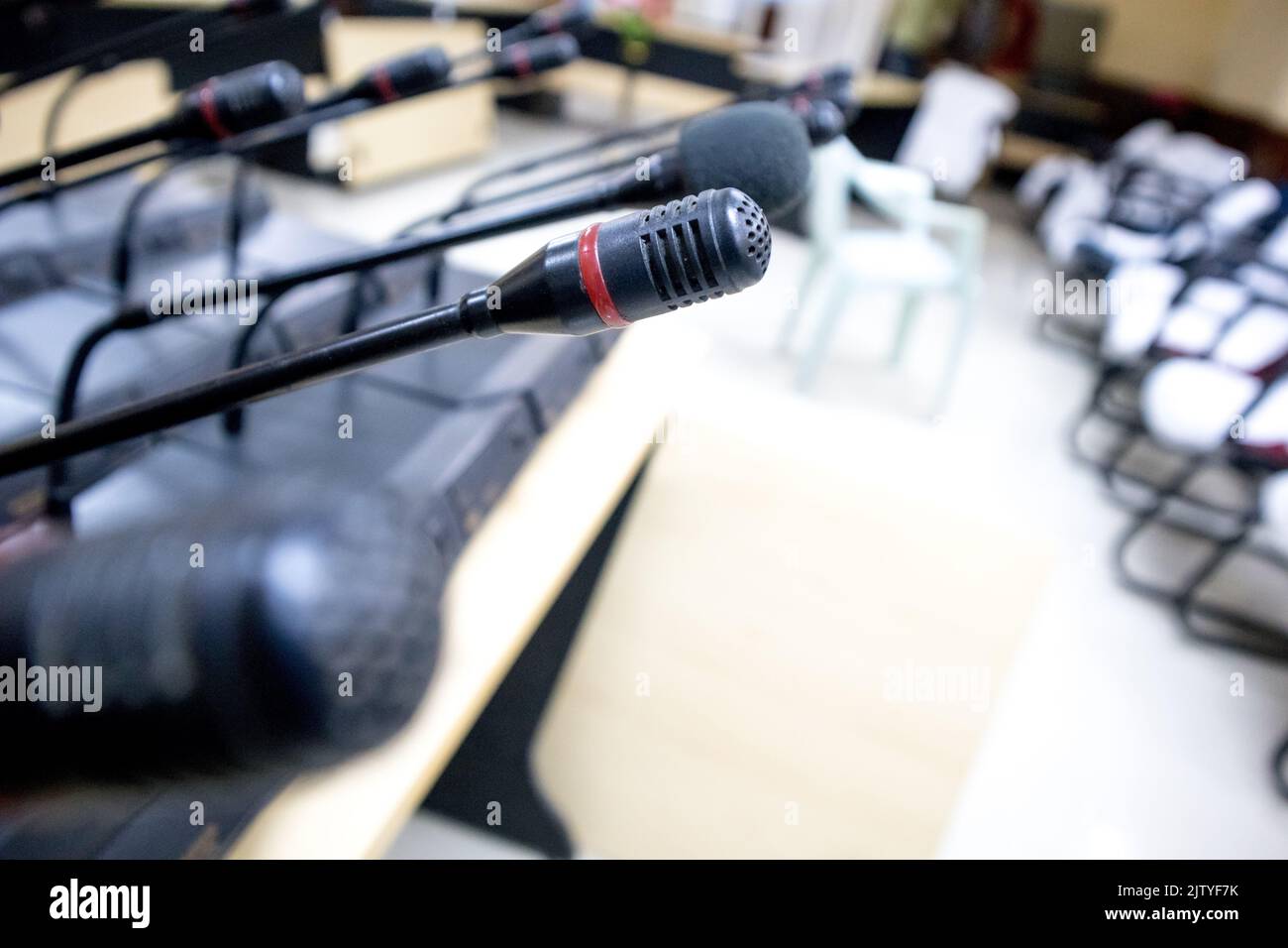 A mic in focus among several. The mics are placed for a information ...