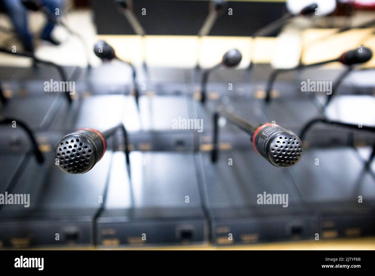Two mic in focus among several. The mics are placed for a information ...