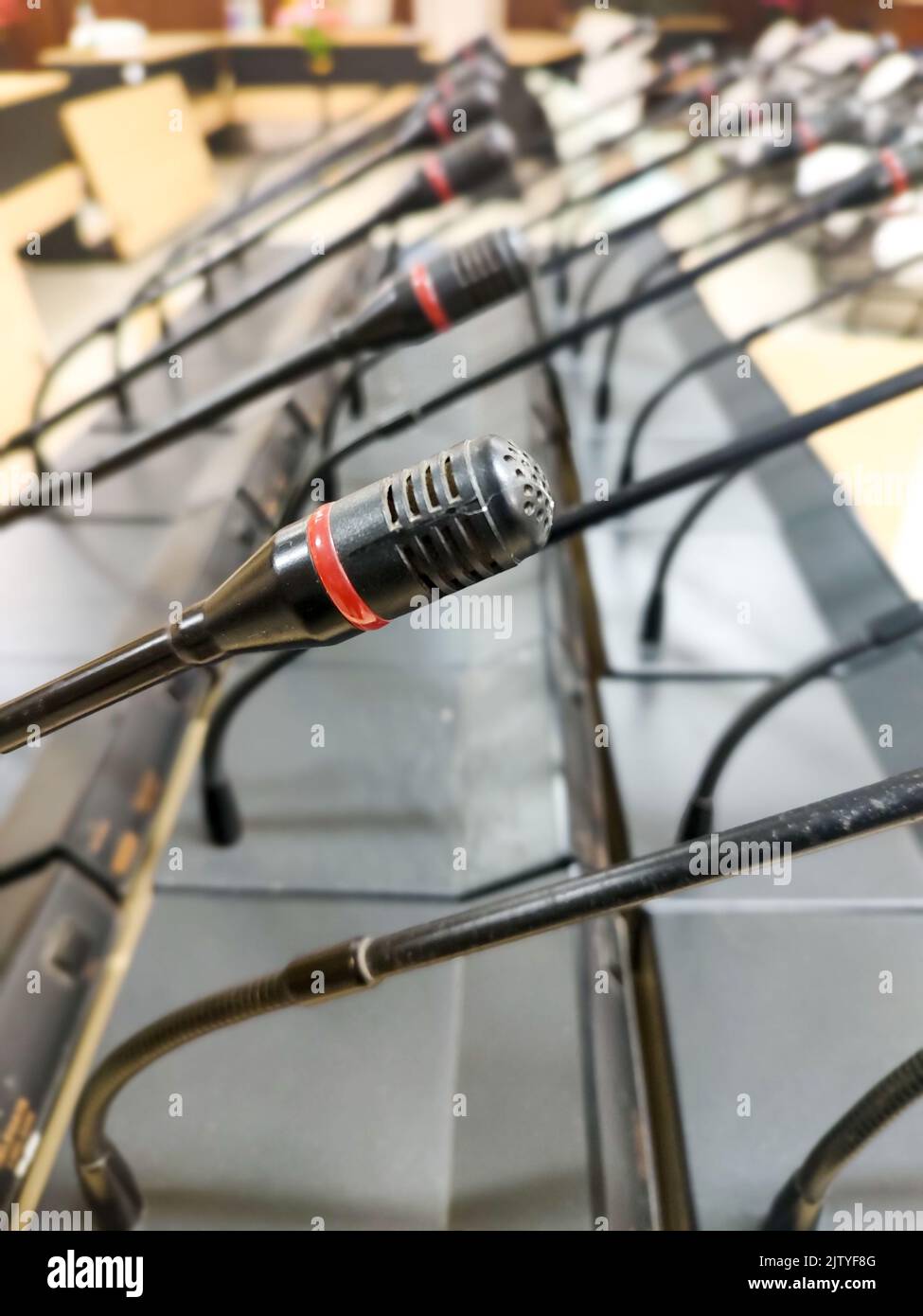 A mic in focus among several. The mics are placed for a information ...