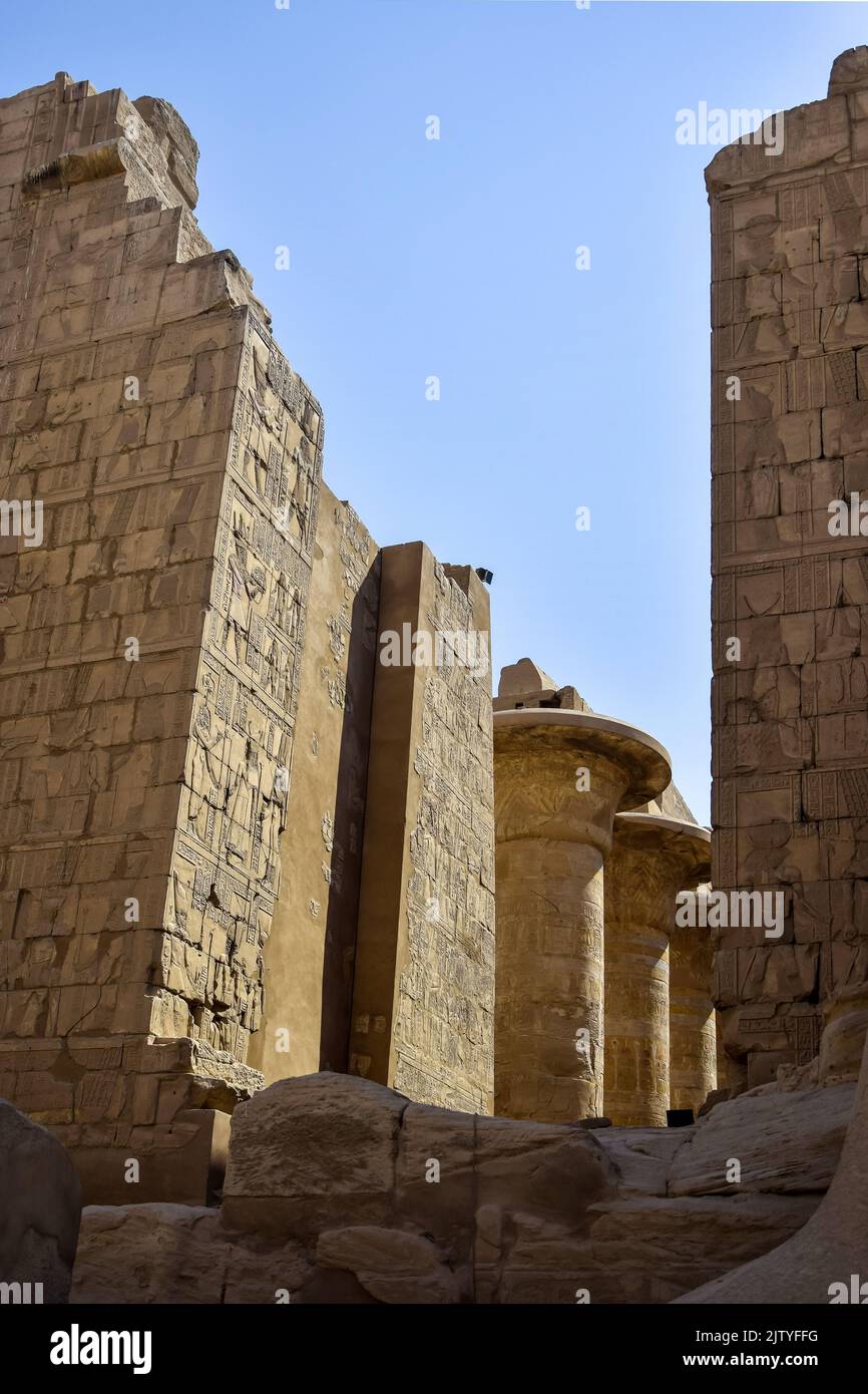 Ruins of Karnak Temple complex with halls decorated with sculptures and ...