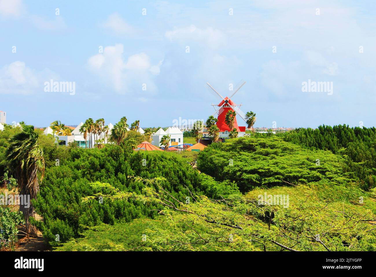 An old Dutch windmill and other buildings, viewed across a large ...