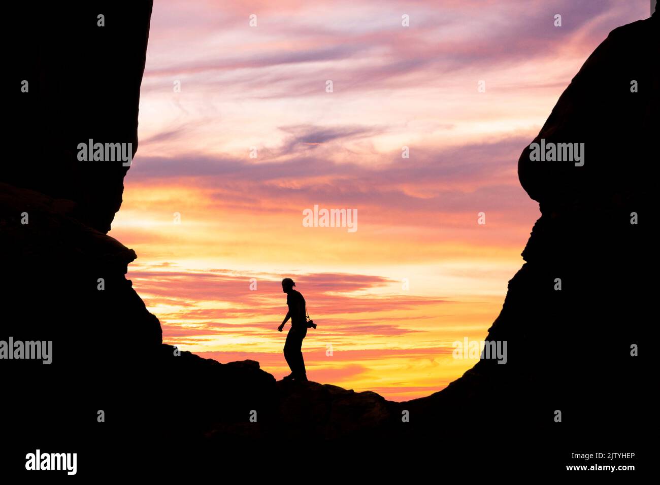 A man exploring a cave Stock Photo - Alamy
