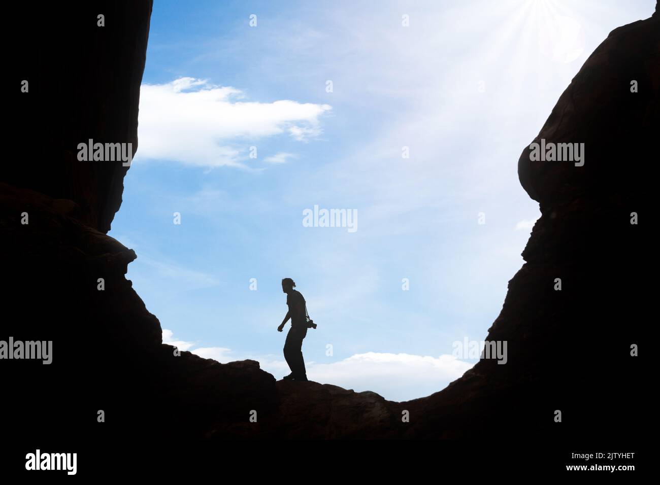 A man exploring a cave Stock Photo - Alamy