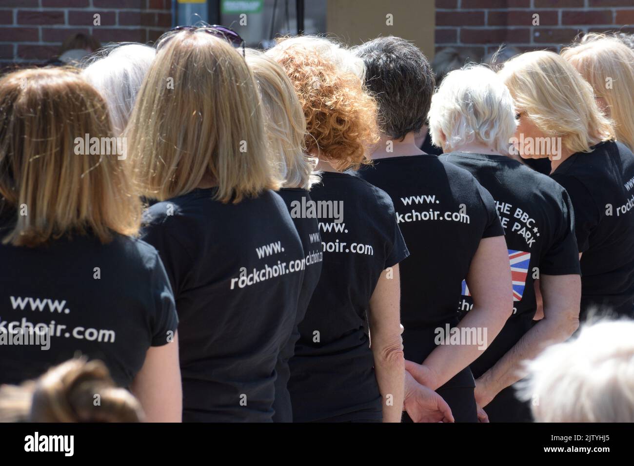 Ladies Rock choir back view Stock Photo - Alamy