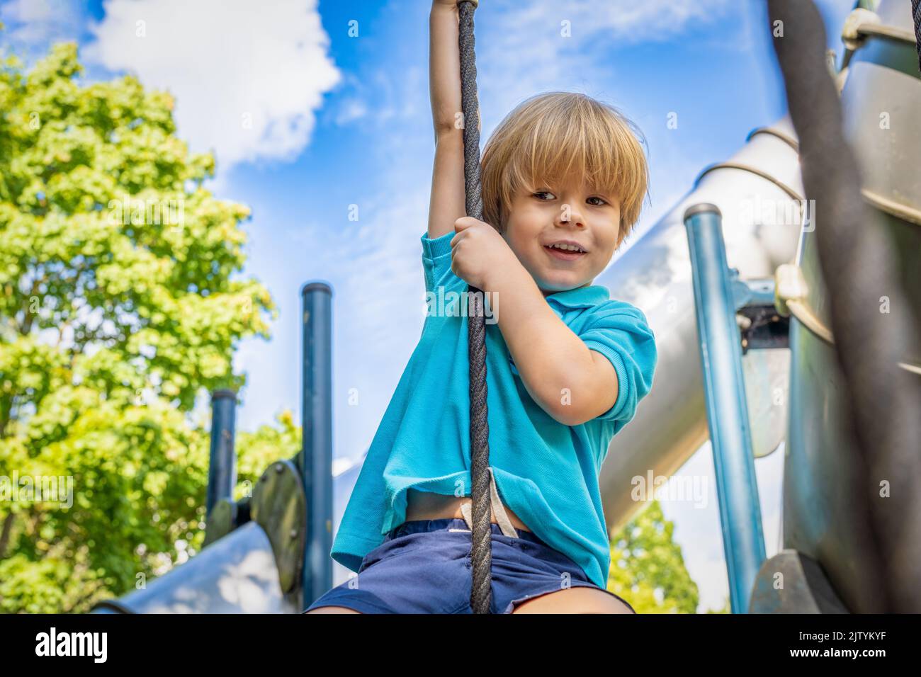 Adorable caucasian boy smiling happy playing at the park Stock Photo ...